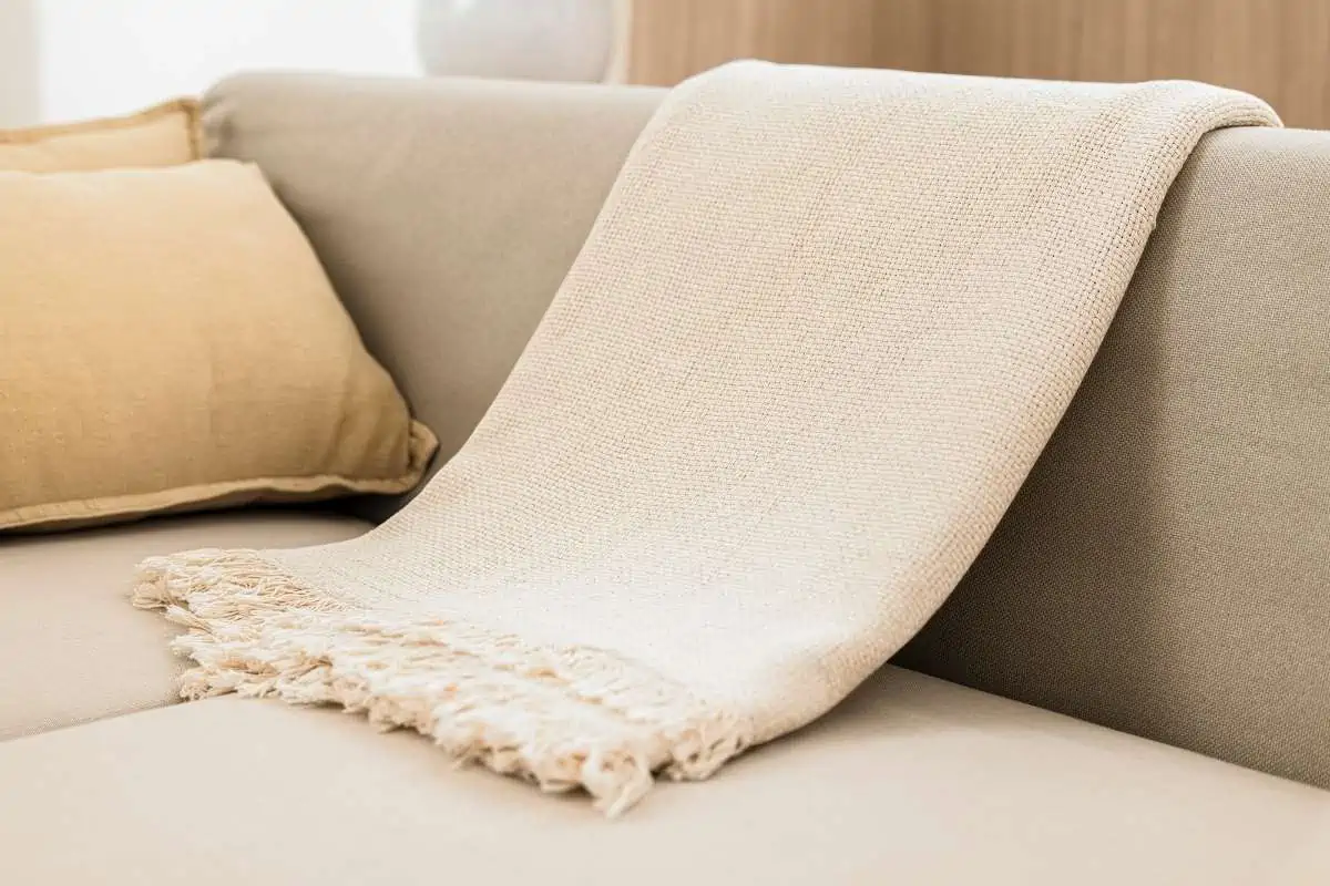 15 Best Ways To Style A Throw Blanket - Restore Decor & More